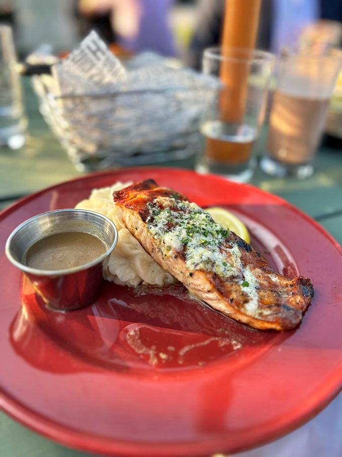 A perfectly grilled salmon fillet gets dressed up with herb butter, proving simple can be simply magnificent.