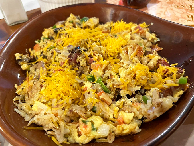 It's not a mess, it's a masterpiece! This hearty scramble at 5th Avenue Cafe is like abstract art you can eat &ndash; colorful, chaotic, and utterly satisfying. Photo credit: Jerry L.