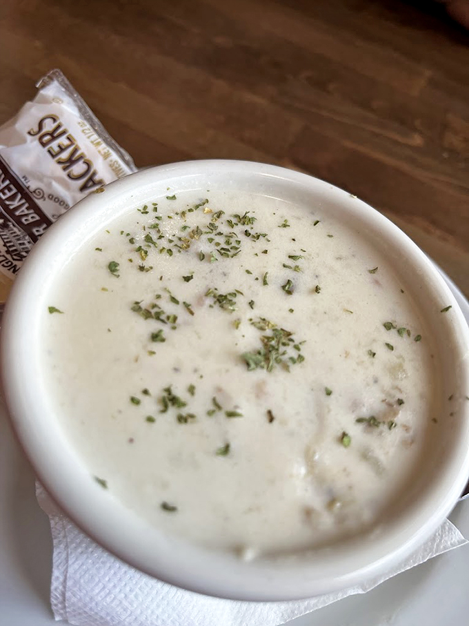 Creamy, herb-flecked chowder that looks like it could warm even the chilliest Maine evening. Pure coastal comfort in a bowl. 
