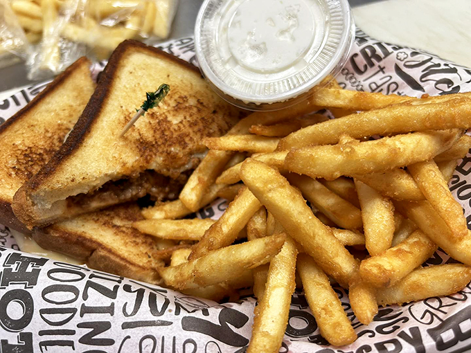 A sandwich that requires both napkins and commitment, with fries that deserve their own fan club.