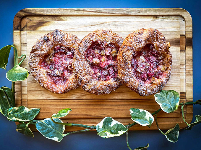 Strawberry rhubarb nestled in flaky pastry: spring's sweetest love story, told in buttery chapters.