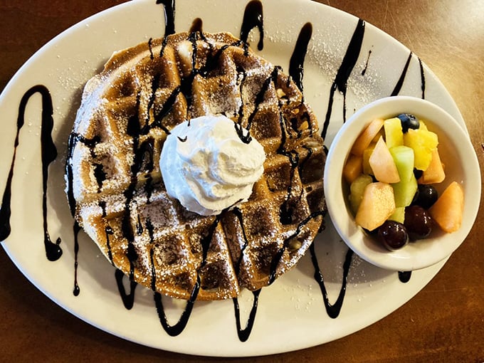This Belgian waffle, drizzled with chocolate and topped with whipped cream, turns breakfast into a celebration. Photo credit: 5th Avenue Cafe