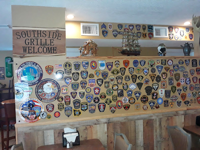A stunning collection of first responder patches tells stories of service and community, creating a wall of honor.