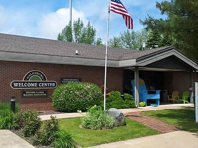 Modern hospitality meets small-town warmth at this well-maintained welcome center, complete with patriotic spirit flying high.