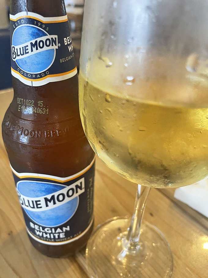 A cold Blue Moon stands ready to complement your seafood feast, catching Florida's golden afternoon light.