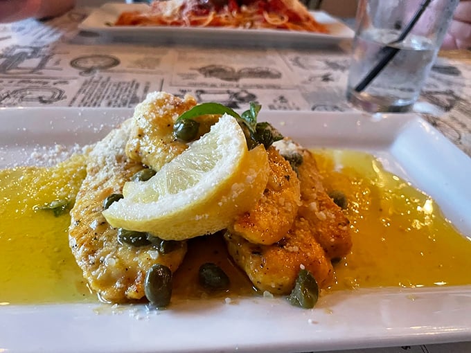 Chicken Piccata: A lemony, buttery, caper-studded masterpiece that's brighter than a Florida sunrise. It's sunshine on a plate, folks! Photo credit: William Ruckdeschel