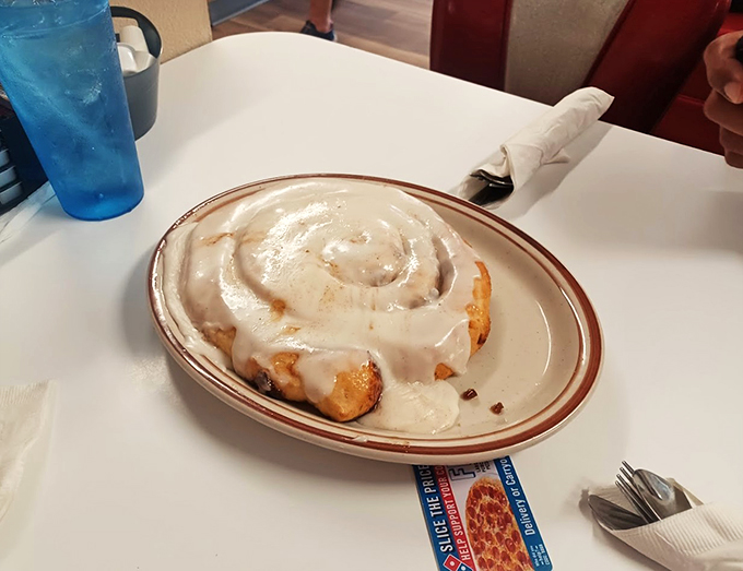 This cinnamon roll isn't just breakfast, it's a commitment. Tackle it solo or bring reinforcements – either way, you're in for a treat.