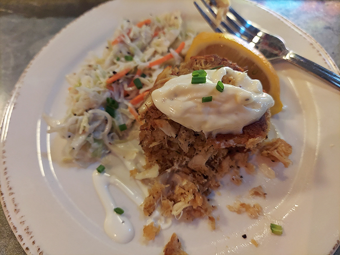 Crab cake perfection! This golden-brown beauty is like the Mona Lisa of seafood - a true work of art that's almost too pretty to eat.