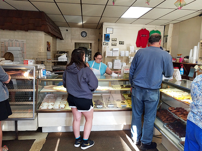 The line between man and donut blurs here. Hinkley's patrons patiently await their turn, united in their quest for the perfect pastry.