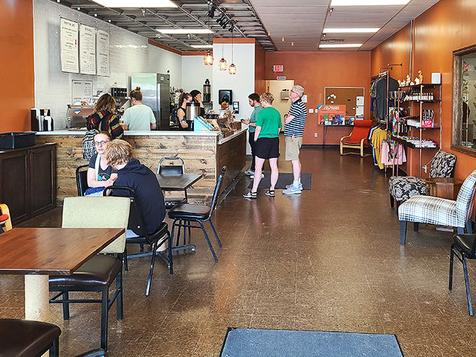 Coffee, conversation, and cats - the holy trinity of relaxation. These patrons have found the secret to happiness, one sip at a time.