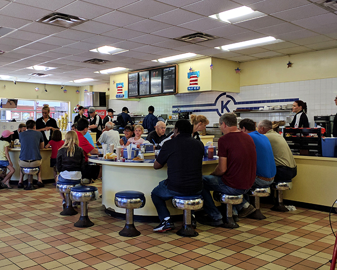 Where everybody knows your order! This bustling counter scene's got more energy than a Springsteen concert, fueled by burgers and good vibes.