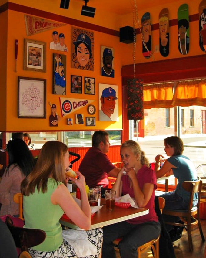 Happy diners in their natural habitat. The smiles are as bright as the decor, proving good food makes for great times.