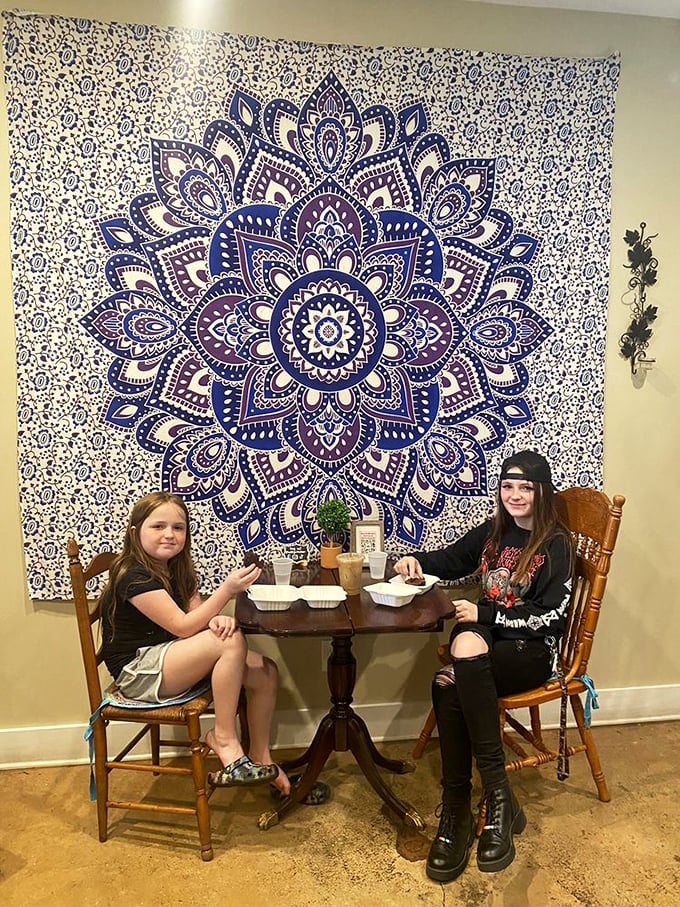 Dining with a side of whimsy! This eclectic seating area feels like you've stumbled into a bohemian cat lady's fever dream &ndash; in the best possible way.