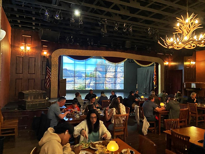 Dinner and a show? The massive screen brings the great outdoors inside, while diners tuck into meals that would make a cowboy weep with joy.