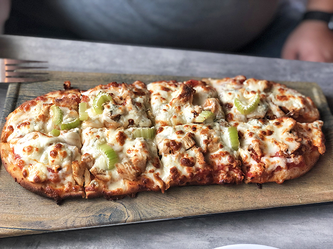 This chicken and celery flatbread brings buffalo wing flavors to pizza form - a clever remix of everyone's favorite game day snack.