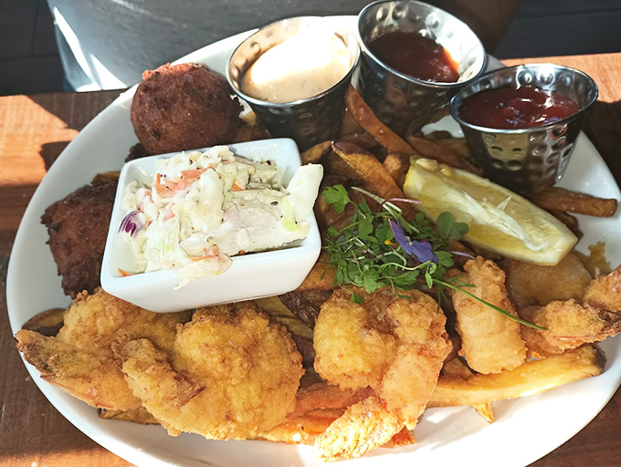 A seafood platter that's basically a beach party on a plate. From crispy shrimp to creamy slaw, it's a deep-fried love letter to the ocean.