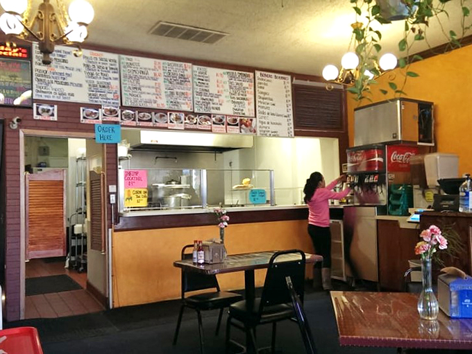 Cozy vibes and spicy lives! This interior might be simple, but it's the perfect backdrop for the flavor explosions about to happen on your plate.