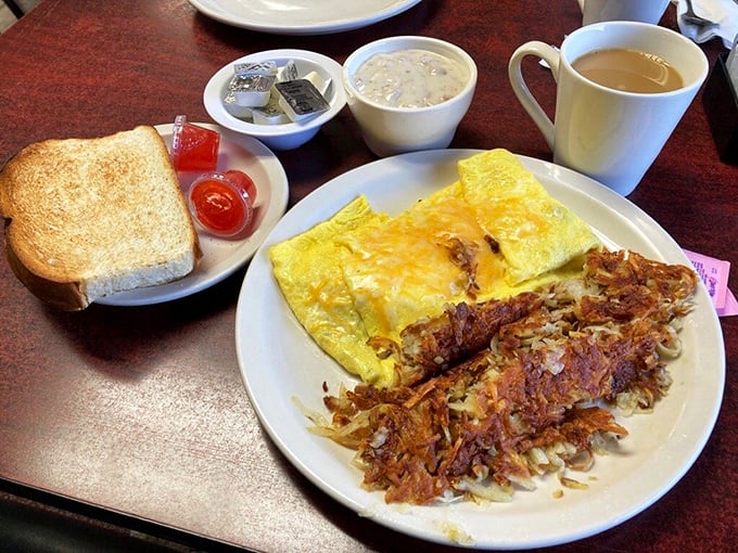Eggs-cellent choice! This omelet and hash brown combo is the breakfast of champions... and anyone else who loves a good food coma.