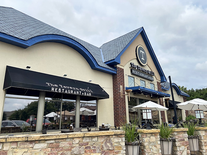 Rustic elegance meets comfort food heaven! The Tavern Grill's stone facade hints at the warm welcome waiting inside. Photo credit: Peter Mathys