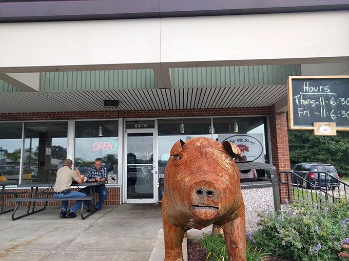 Quirky pig statue, serious flavors inside. The Pit Stop is the roadside attraction that becomes the highlight of your trip.