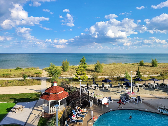 The outdoor pool area offers a perfect vantage point for watching waves roll in from the Great Lake beyond.