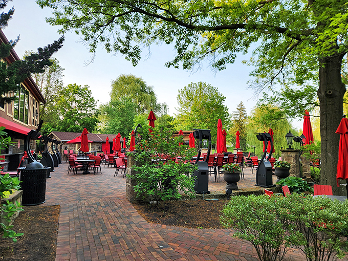 Red chairs, green trees, and endless possibilities. This patio is basically a Choose Your Own Adventure book, but with more Pinot.