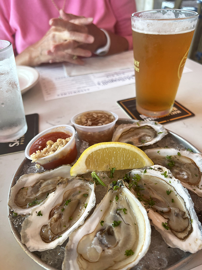 The perfect pairing: briny oysters and a crisp local brew. It's like the ocean and the tap decided to become best friends.