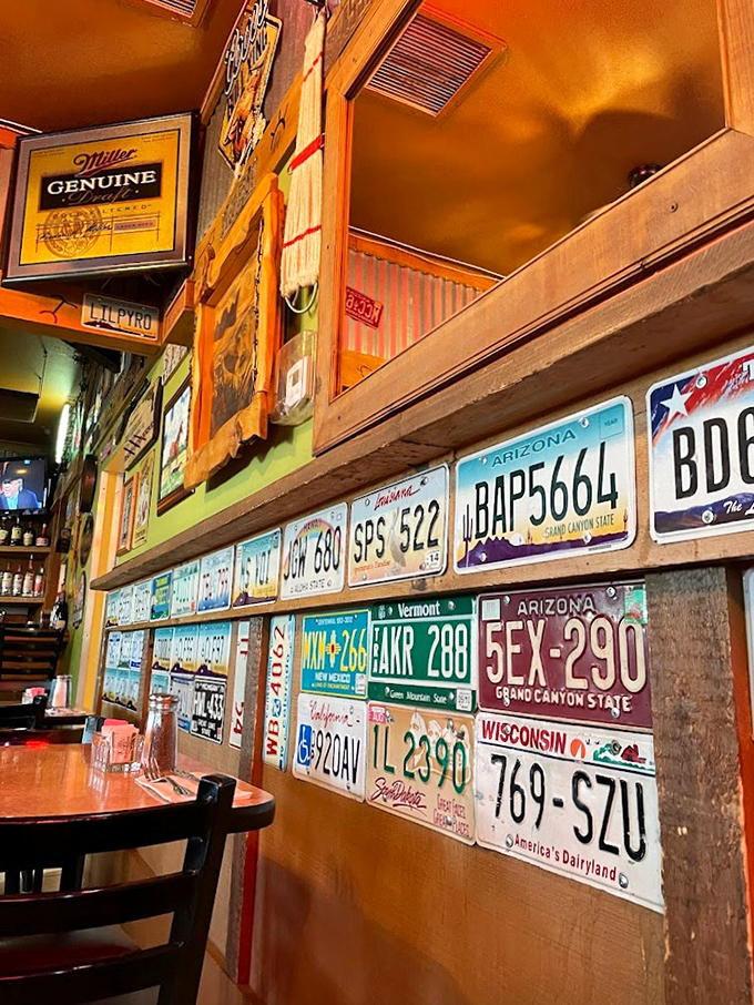 A wall that tells a thousand road trips. Each plate has a story, much like the folks who dine here.