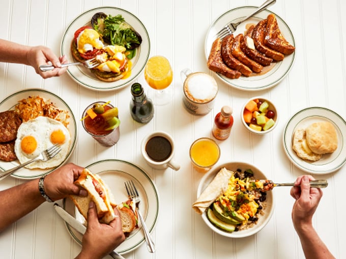Breakfast spread or still life painting? This table isn't just set for a meal; it's a canvas of comfort food that would make Norman Rockwell reach for a fork.