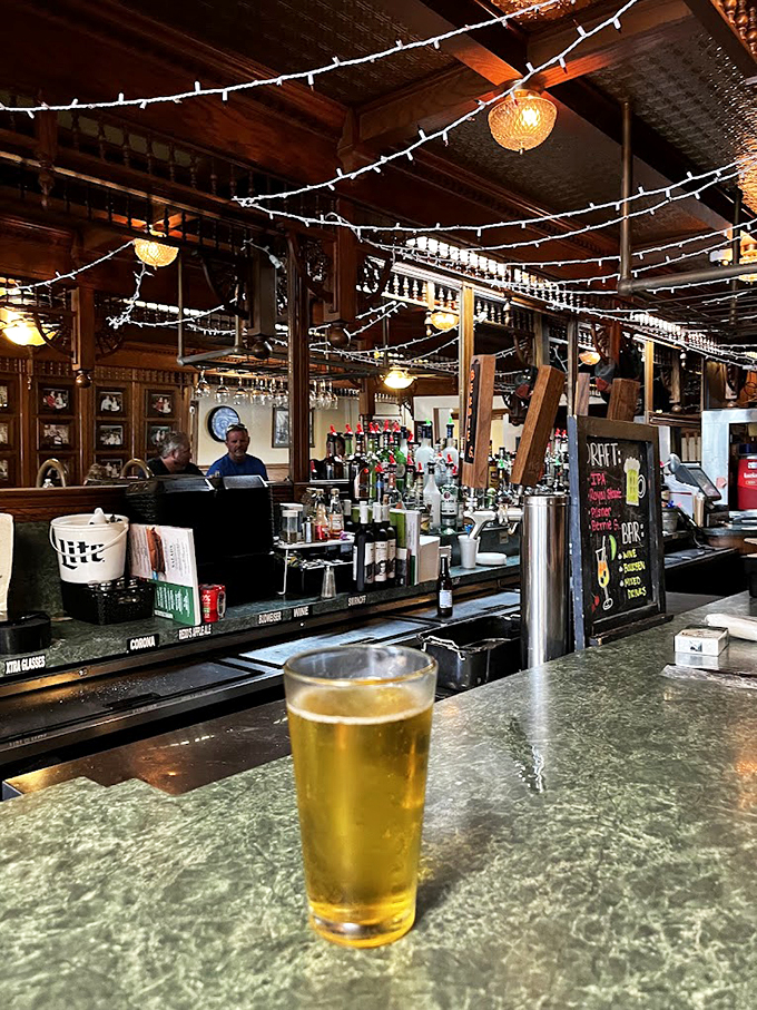 Cheers to good eats! This bar isn't just serving drinks; it's pouring liquid companionship for your meaty feast.