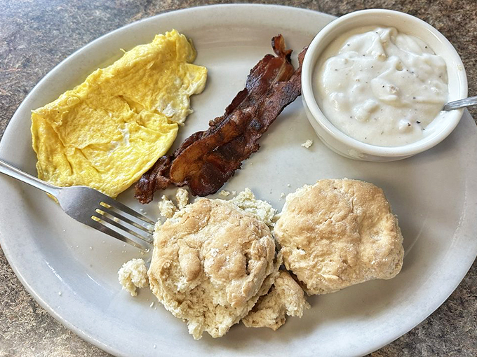Biscuits, gravy, and bacon &ndash; oh my! This combo is the breakfast trifecta that'll make you want to hug the cook (but maybe ask permission first). Photo credit: Karen W.