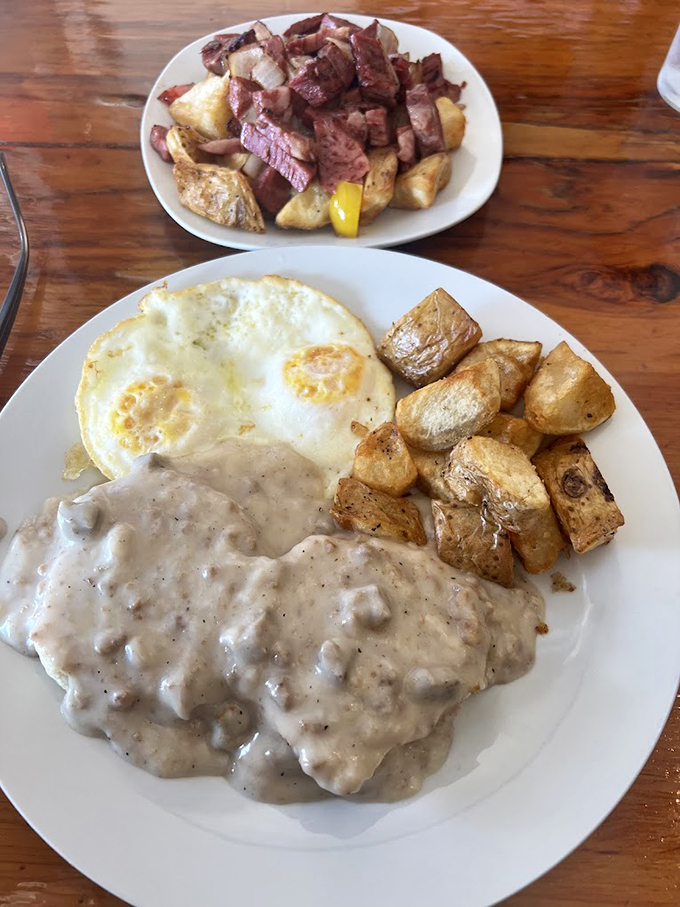 Comfort food perfection: creamy sausage gravy blankets fresh biscuits like a warm morning hug from your favorite aunt.