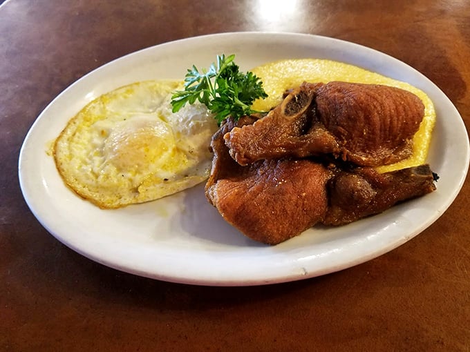 Golden eggs and perfectly seasoned ham share the spotlight on this plate of morning comfort. Photo credit: 5th Avenue Cafe
