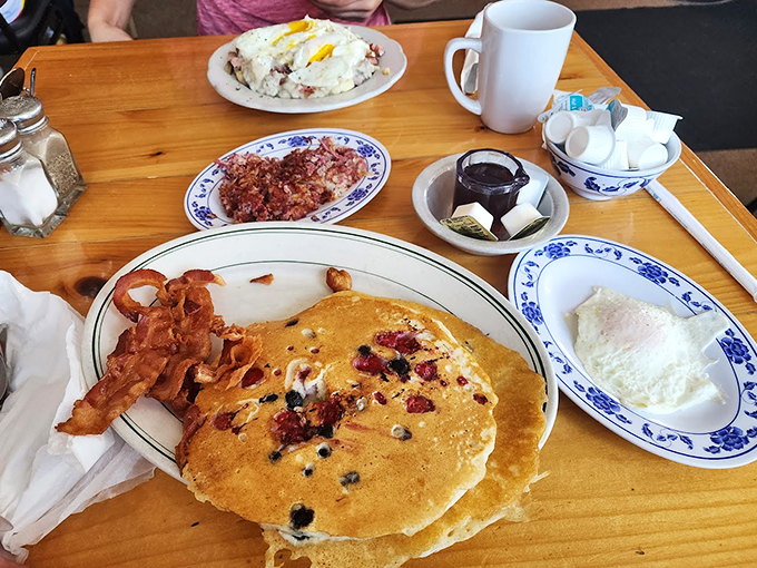 A breakfast spread that would make Ron Swanson proud! From fluffy pancakes to crispy bacon, it's a morning feast fit for a lumberjack... or just a very hungry you.
