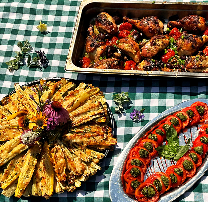 A feast fit for royalty: roasted chicken, grilled vegetables, and tomatoes dressed in their Sunday best.
