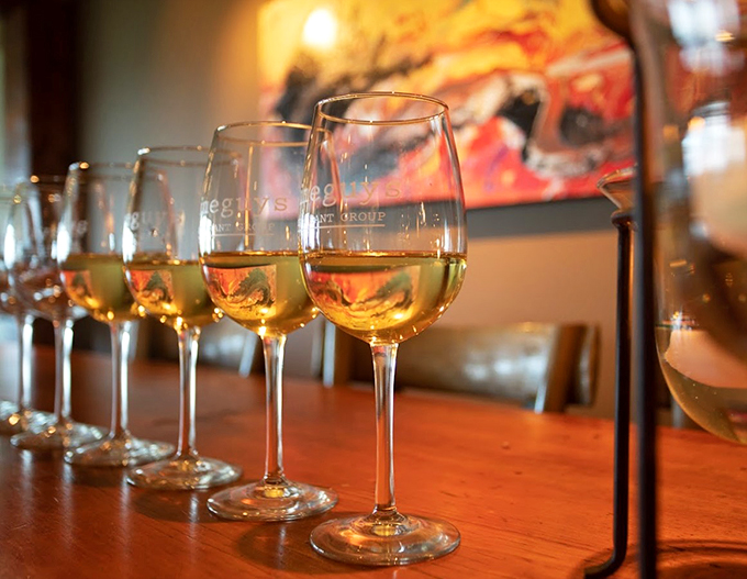 A lineup of golden glasses catching the light&mdash;like liquid sunshine waiting to brighten your celebration.