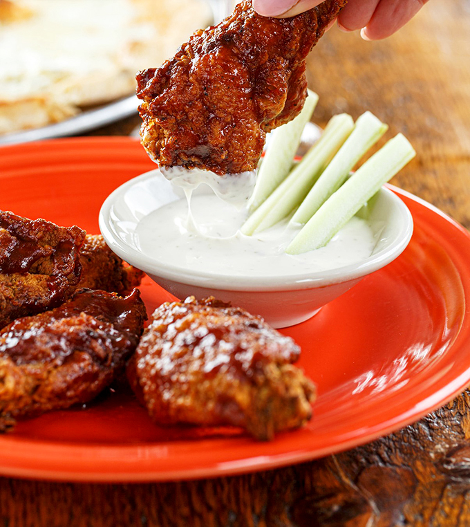 These wings aren't trying to be Buffalo's - they're doing their own delicious thing with a side of cool ranch.
