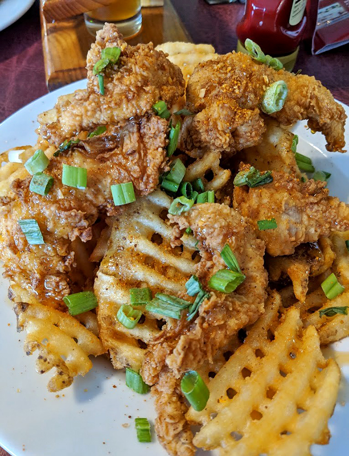 Crispy chicken meets waffle fries in a dish that makes you wonder why you'd ever need fancy restaurant prices.