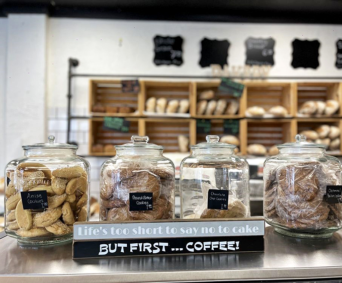 Glass jars stand guard over their sweet inhabitants, while witty signs remind us that life's indeed too short to skip dessert.