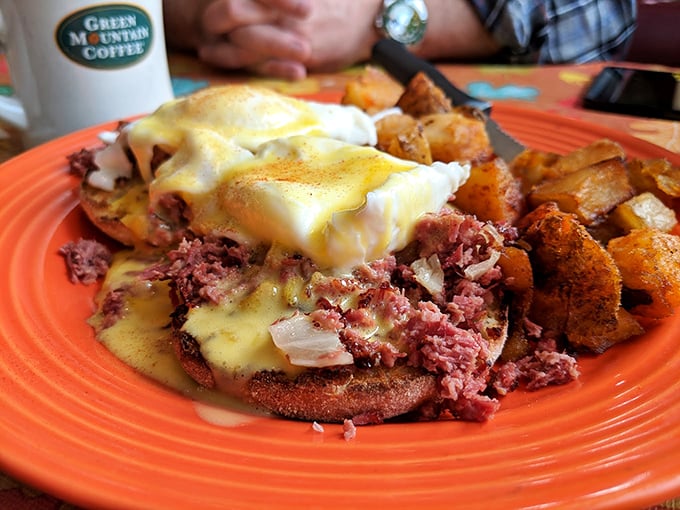 Corned beef hash Benedict that's dressed to impress, with hollandaise sauce flowing like a yellow waterfall.