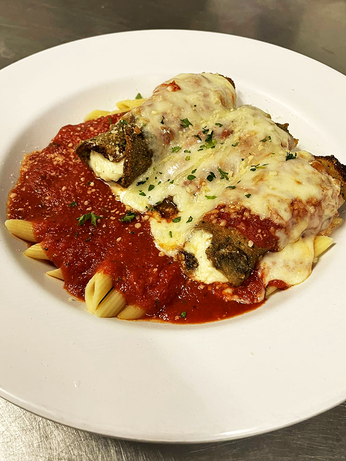 Eggplant Rollatini: Italy's answer to the burrito. These little veggie rolls are proof that not all superheroes wear capes – some wear cheese.