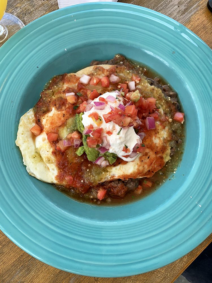 Huevos Rancheros: where eggs get dressed up and go to town! This plate is a fiesta of flavors that'll have you saying "Buenos d&iacute;as!" no matter what time it is.