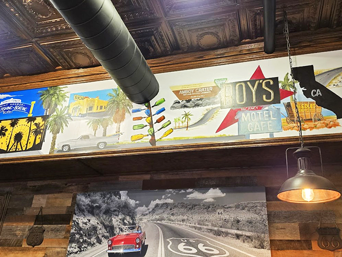 A colorful journey through Route 66 landmarks wraps around the dining room like a roadmap to nostalgia.