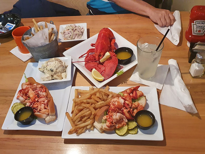 A feast fit for Neptune himself &ndash; lobster rolls, fries, and all the fixings spread out like buried treasure. Photo credit: Quantum Aurora