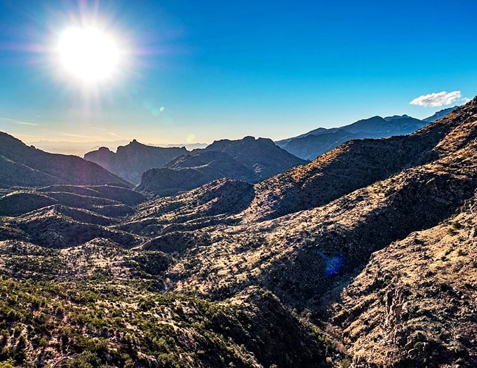 The sun plays spotlight on these rocky peaks, creating a light show worthy of a Vegas headliner.
