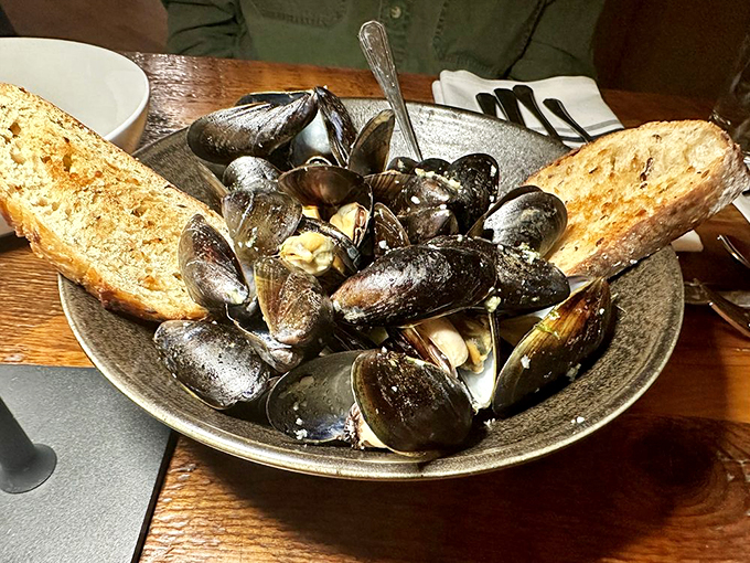 Local mussels bathed in garlic butter, with crusty bread standing by for the delicious duty of sauce-soaking.