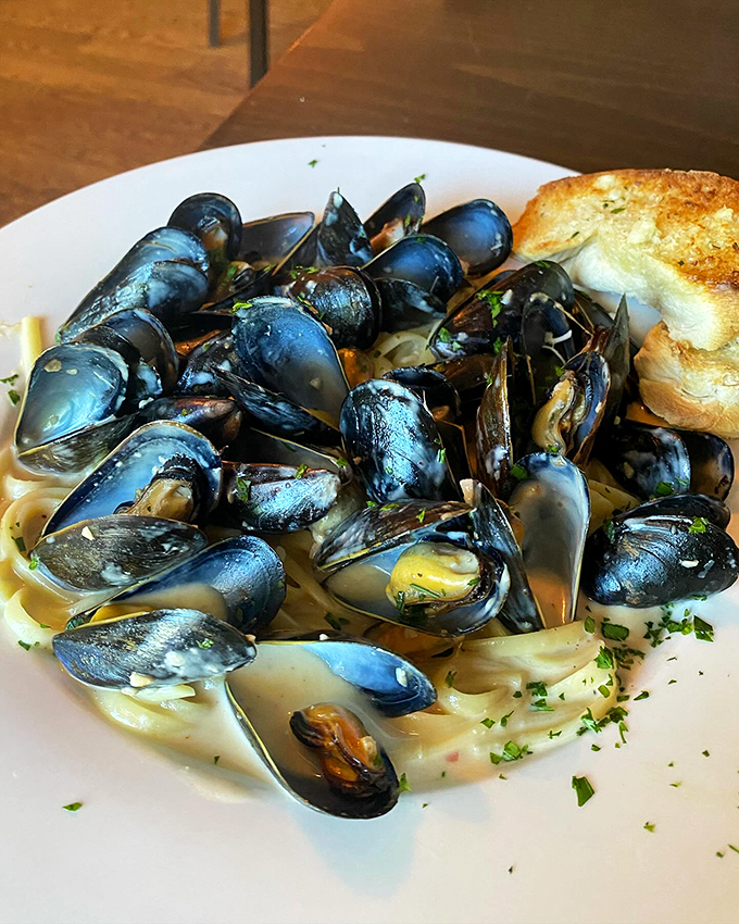 Fresh mussels nestled in a bed of pasta, creating a seaside symphony that brings the coast to Vermont.
