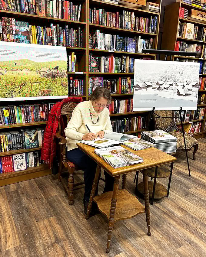 Caught in the act of creation! An author brings stories to life, surrounded by the very books that inspire literary dreams.