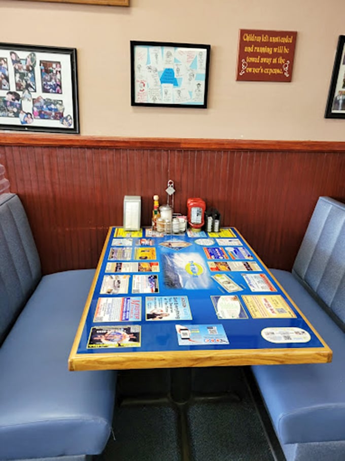 Cozy booth seating with local charm plastered across the walls - the kind of spot where regulars become family.