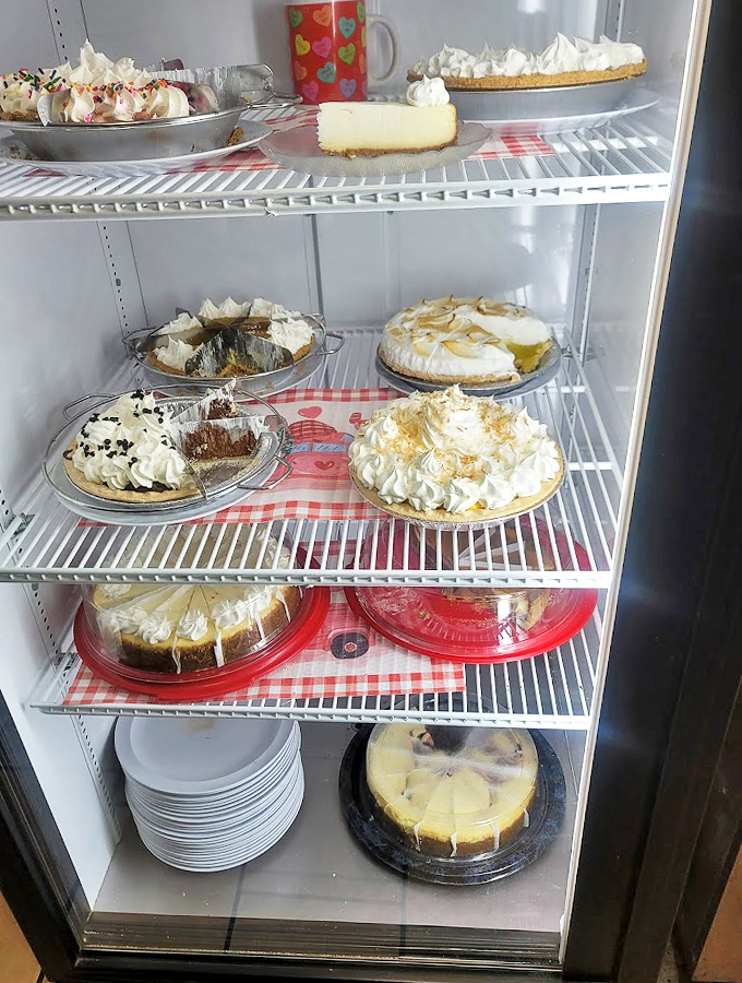 The dessert case looks like it raided grandma's pie contest entries - each one more tempting than the last.